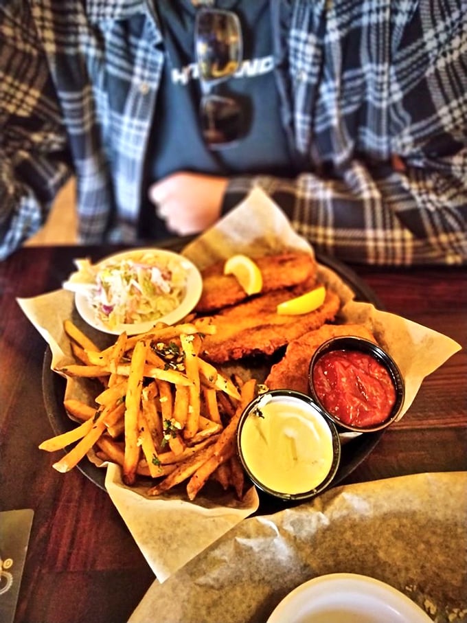 Golden-battered fish and perfectly crisp fries served with two dipping sauces. The kind of fish and chips that makes British expats weep with joy.