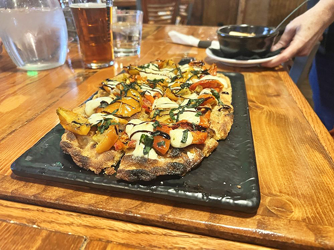 This flatbread is what happens when mountain air inspires culinary creativity. Fresh vegetables and melted cheese on a perfectly crisp crust&mdash;a handheld slice of heaven.