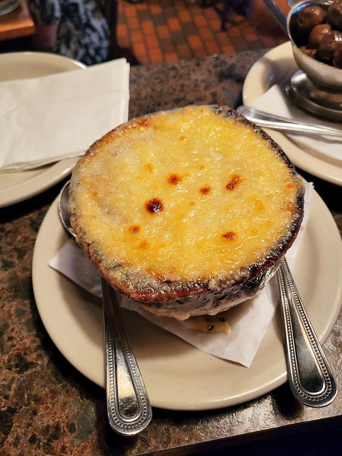 French onion soup with that perfect cheese pull &ndash; it's like wearing a warm sweater on a cool day, except the sweater is made of caramelized onions and Gruy&egrave;re.