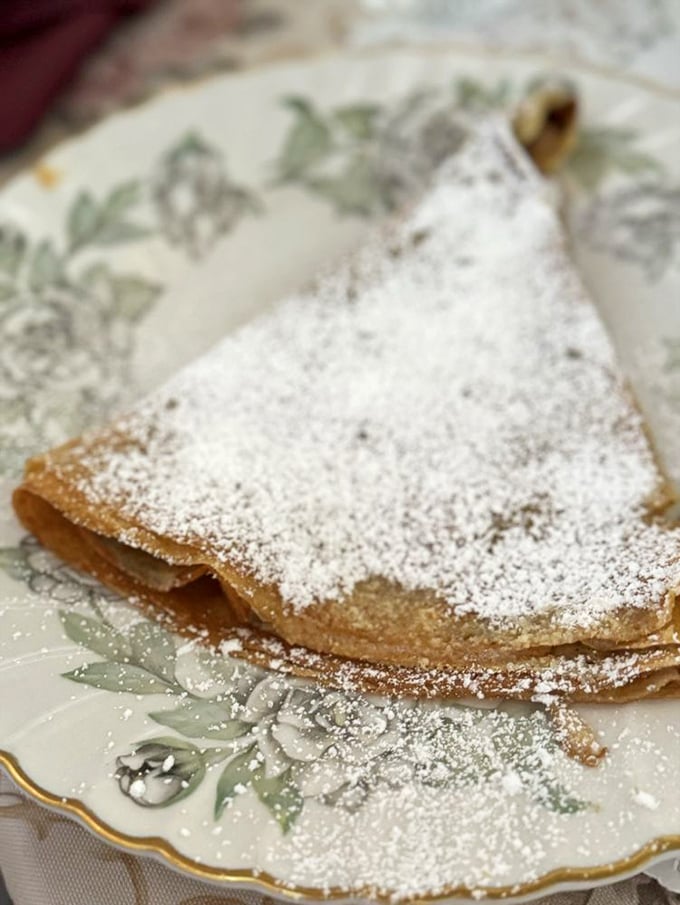 This delicate crepe dusted with powdered sugar is what breakfast dreams are made of&mdash;thin, golden, and waiting to transport you to the streets of Montmartre.