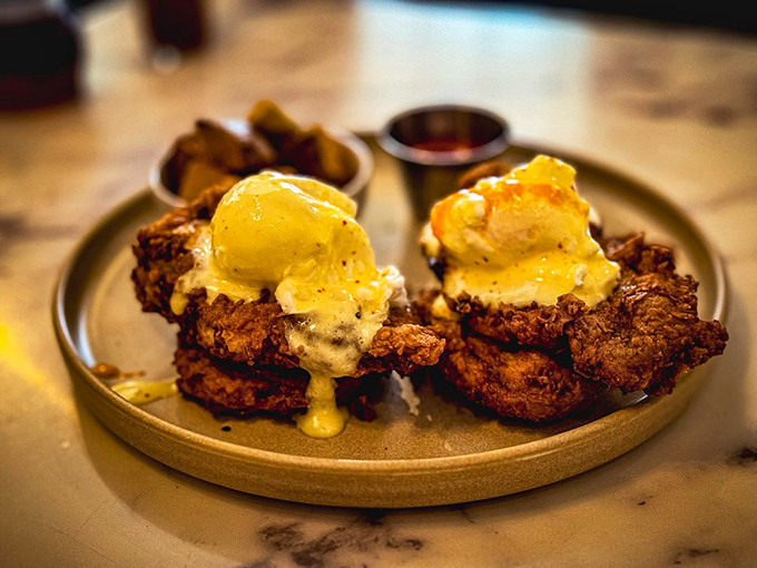 Southern hospitality on a plate: golden-fried chicken nestled between pillowy biscuits, drizzled with something that makes calories completely irrelevant.