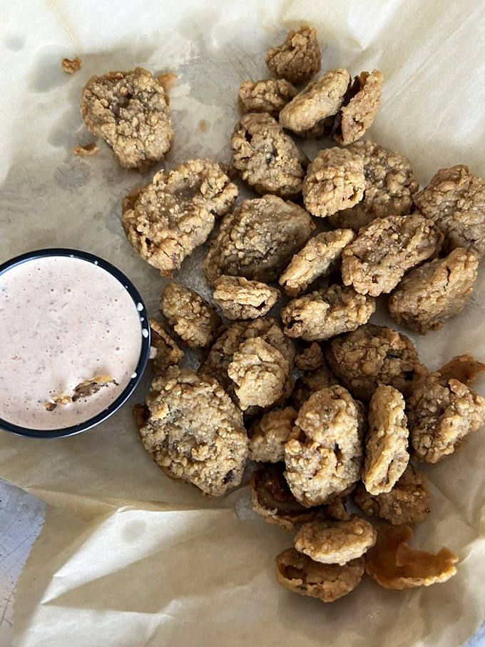 Fried mushrooms that could convert even the most dedicated carnivore. That dipping sauce isn't optional&mdash;it's the perfect dance partner.