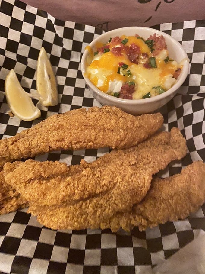 Fried catfish so perfectly golden, it belongs in Fort Knox. Paired with mac and cheese that's clearly been taking its comfort food responsibilities seriously.