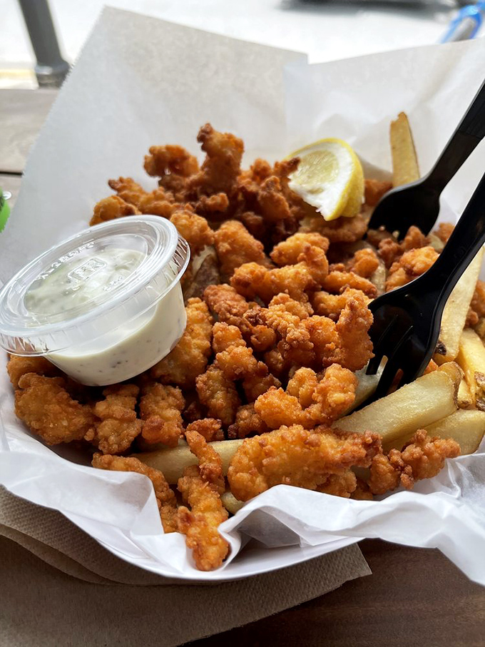 Golden-fried clam strips and crispy fries&mdash;the dynamic duo of seafood satisfaction. Like edible sunshine that comes with its own dipping sauce.