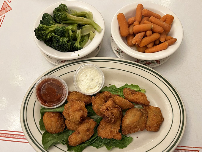 Golden-fried oysters with sides that know their role&mdash;supporting players that complement without stealing the spotlight from the crispy star.