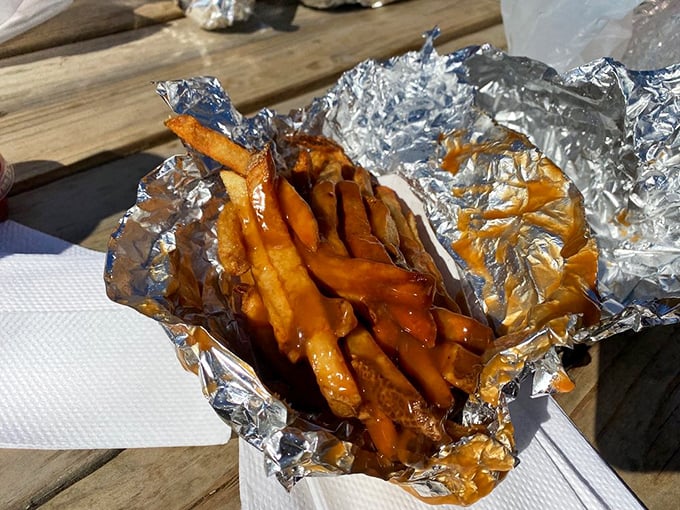French fries swimming in gravy—the comfort food equivalent of a warm hug from your favorite aunt who still pinches your cheeks.