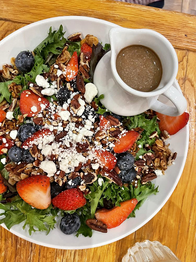 A berry and nut salad that makes eating healthy feel like cheating. Mother Nature showing off with colors that belong in an art gallery.