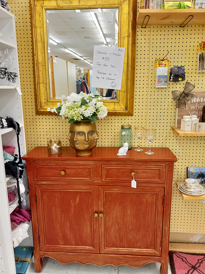 This gorgeous cabinet isn't just furniture—it's a time machine with drawers. And that face-shaped planter? Conversation starter guaranteed.