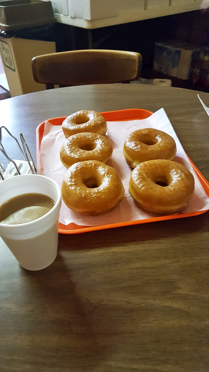 Morning nirvana: a tray of golden Spudnuts and a humble cup of coffee—proof that life's greatest pleasures don't need complicated packaging.