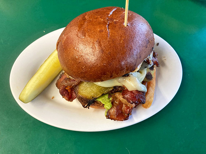 This isn't just a burger; it's architecture with melted cheese, where every ingredient knows its purpose and plays its part perfectly.