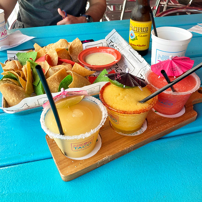 The margarita flight that launched a thousand selfies, served alongside tortilla chips so fresh they're practically still warm from the fryer.