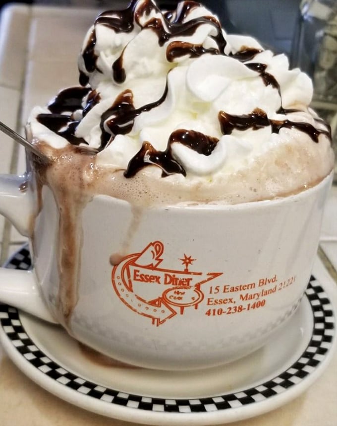 Hot chocolate that's dressed up for a special occasion. That whipped cream mountain with chocolate drizzle rivers makes Monday feel like Saturday.