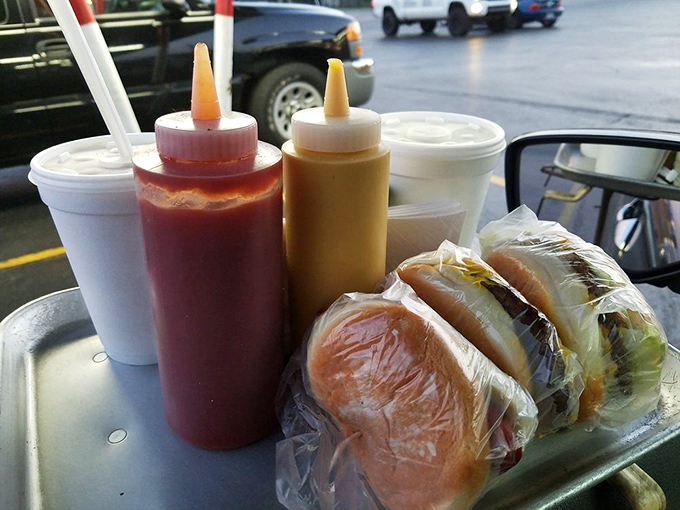 Condiment bottles standing at attention like loyal soldiers, ready to enhance these wrapped treasures waiting to unleash their simple, perfect flavors.
