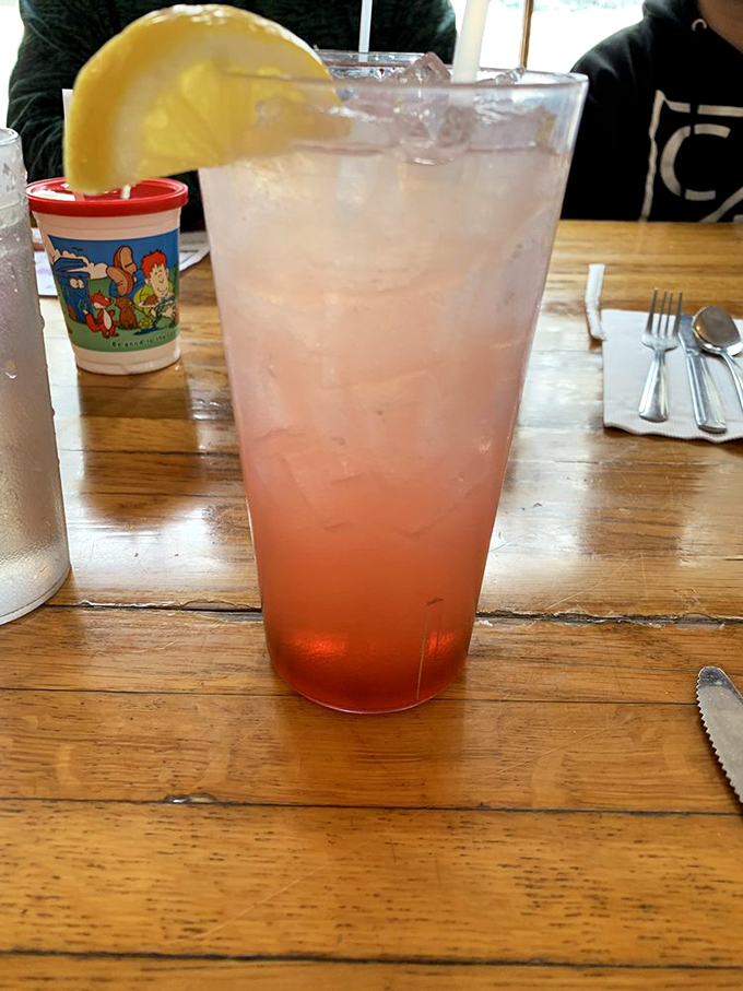 A refreshing pink lemonade that looks like a sunset in a glass&mdash;the perfect companion while waiting for your slice of pie.