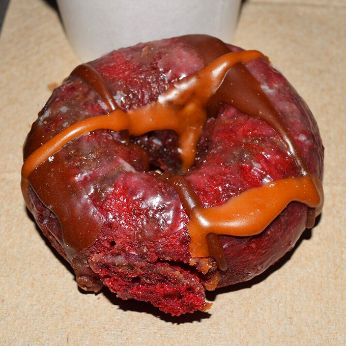 A crimson-hued donut drizzled with what appears to be caramel&mdash;like a sunset over the Carolina coast, if sunsets were edible and filled with calories.