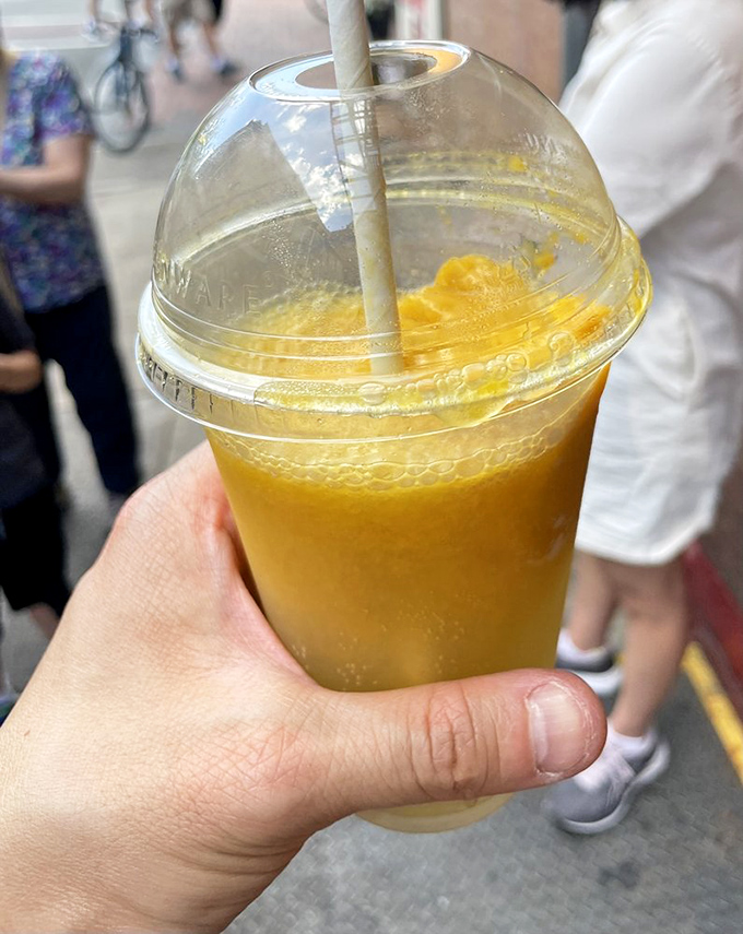 Summer in a cup&mdash;this refreshing citrus limeade with a golden scoop of mango sorbet is basically sunshine you can drink.