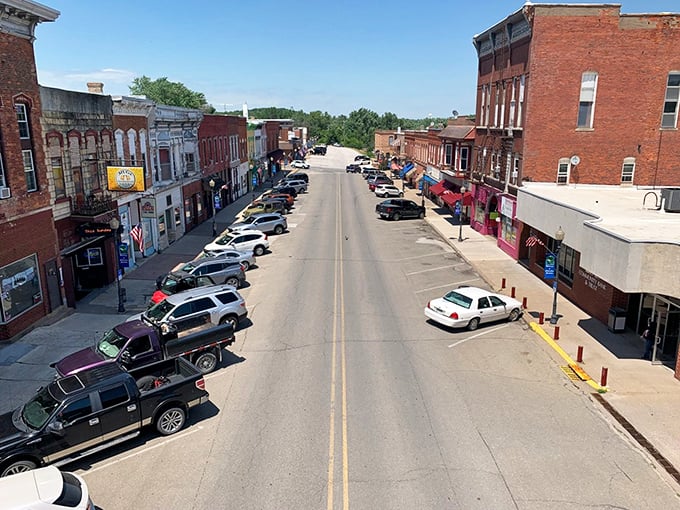 Downtown Kalona from above reveals the classic Midwestern grid pattern. Small town, big heart, and parking that city folks can only dream about.