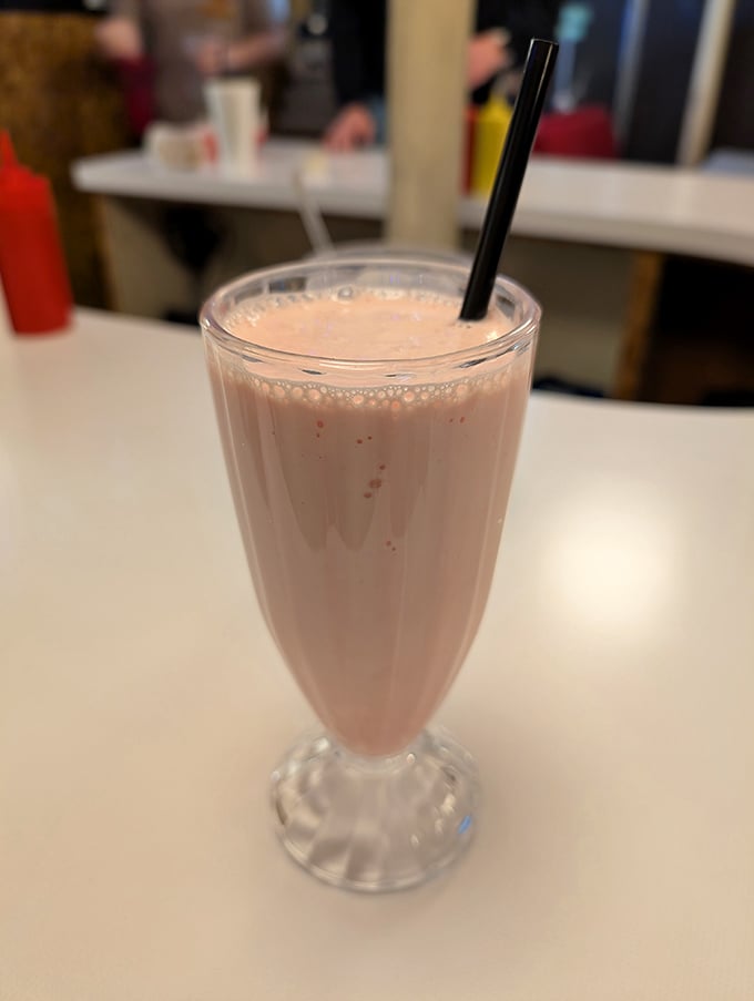 This isn't just a milkshake; it's a time machine in a glass that transports you back to simpler days when happiness cost less than five dollars.