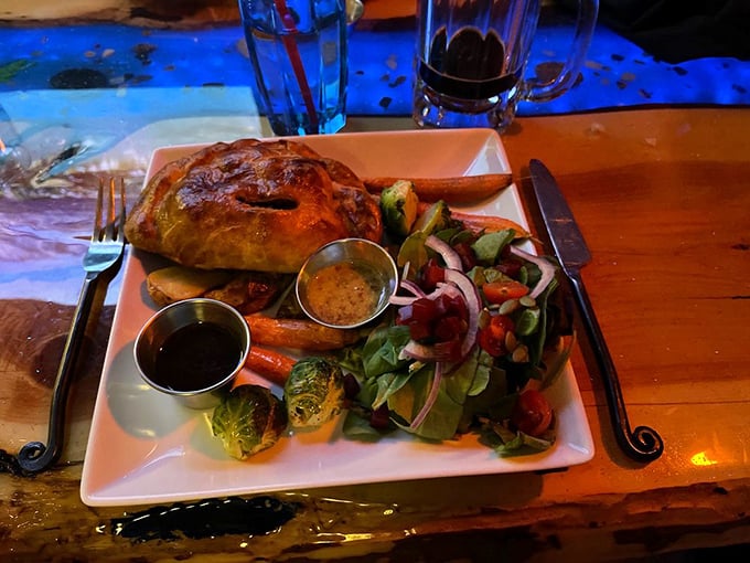 A golden-crusted pasty that looks like it's housing treasures inside, accompanied by a salad that's anything but an afterthought.