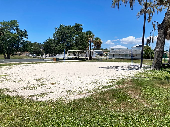 White sand volleyball courts await evening players. During peak season, these courts host tournaments that would put Olympic competitions to shame.