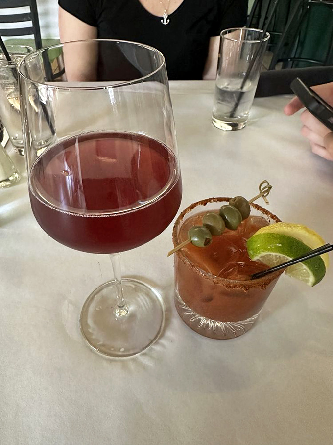 Wine for sophistication, Bloody Mary for recovery &ndash; this table setting suggests someone who understands life's delicate balances.