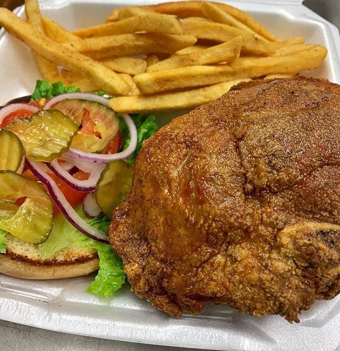 The pork chop sandwich &ndash; where tender fried perfection meets garden-fresh toppings in a harmony that would make a choir director jealous.