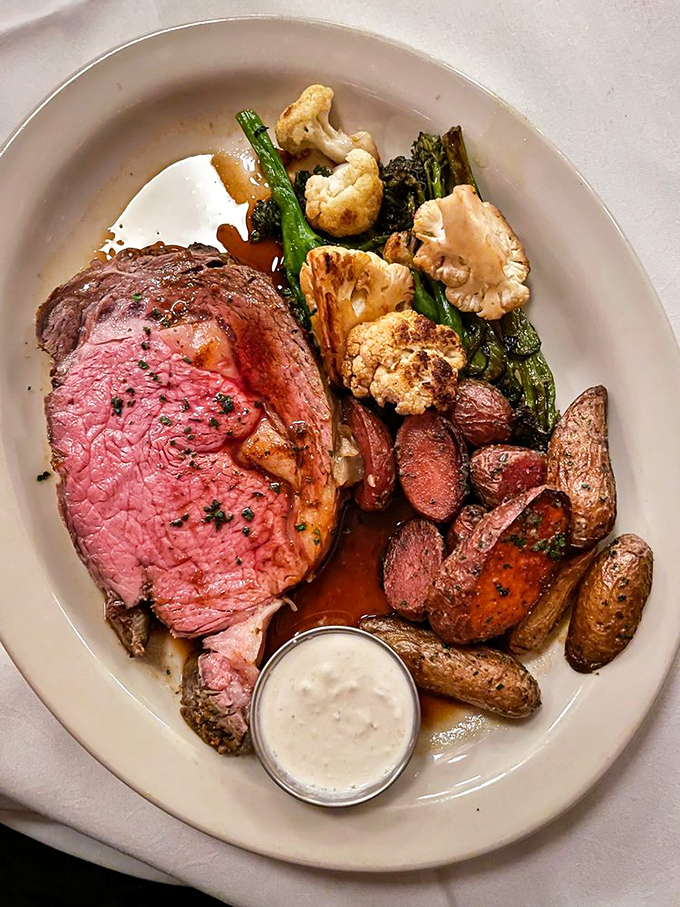 A prime rib so perfectly rosy it could win beauty pageants, accompanied by vegetables that didn't sacrifice their dignity in the cooking process.