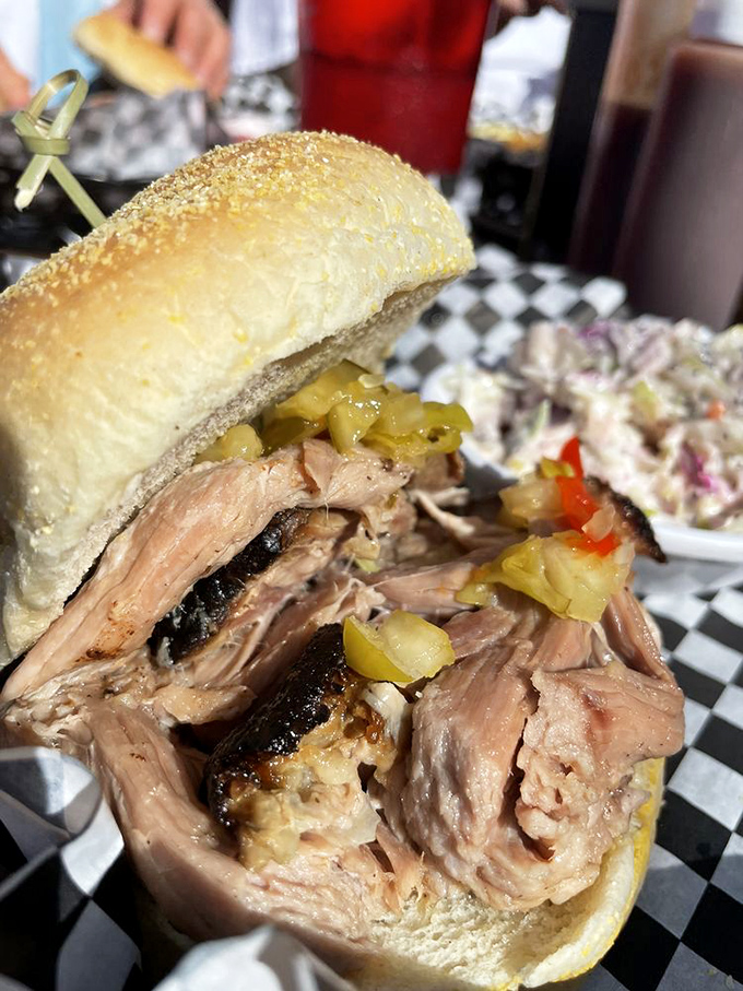 This pulled pork sandwich is architecture you can eat&mdash;a perfect balance of tender meat, soft bun, and tangy pickles.