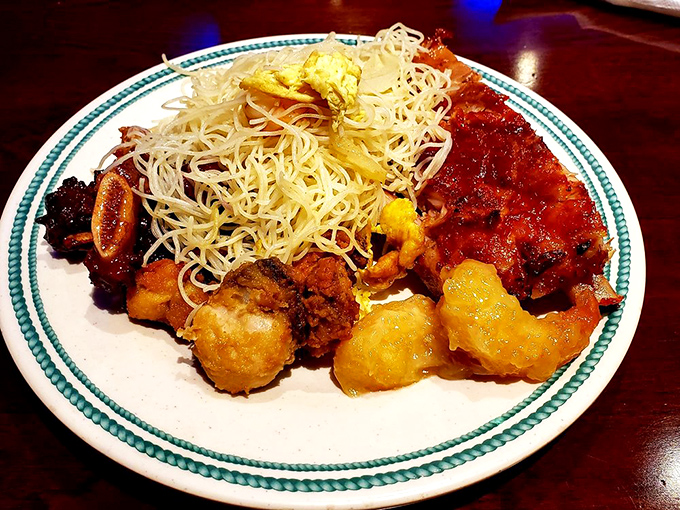 A symphony of textures&mdash;crispy noodles, tender meats, and perfectly fried shrimp. The kind of plate that makes you forget you're in a buffet.