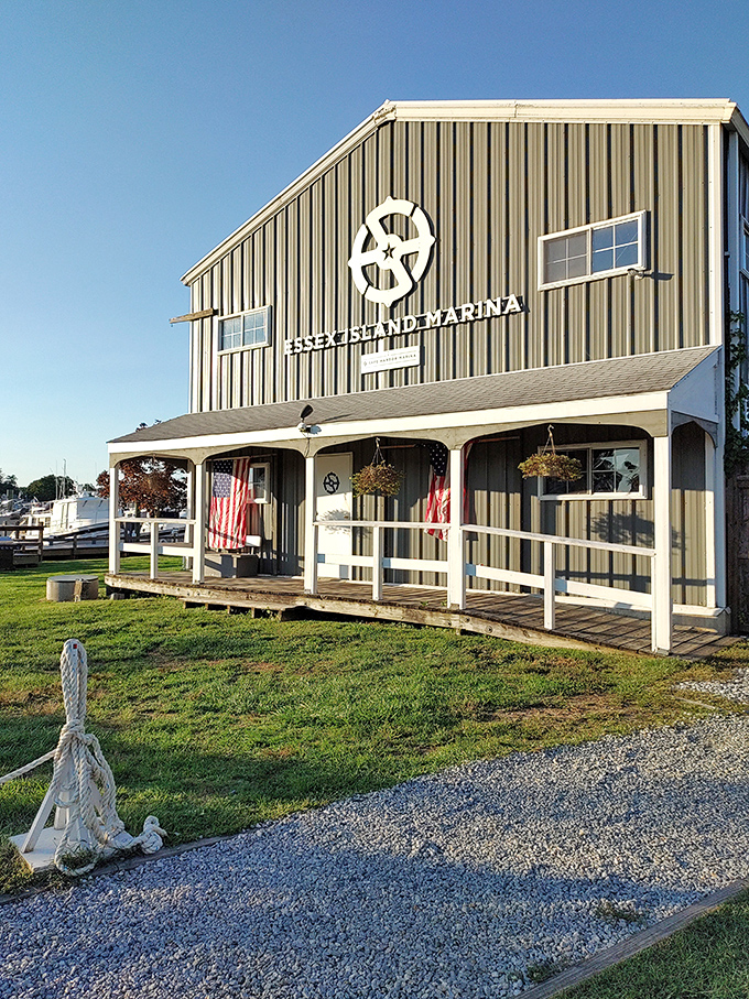 Safe Harbor Essex Island Marina welcomes water wanderers with nautical New England charm. The weathered wood and American flags speak to generations of maritime tradition.