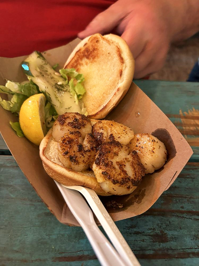 This fish sandwich isn't playing games—serious seasoning, perfect sear, and a bun that knows its supporting role perfectly