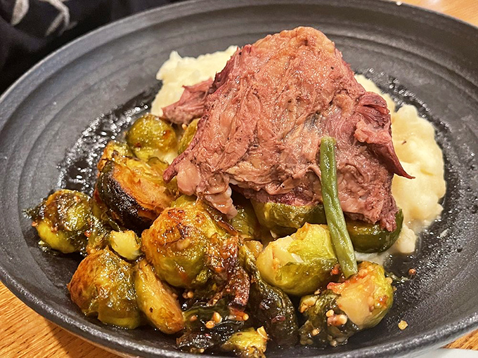 The short rib doesn't just fall off the bone—it practically leaps onto your fork. Those Brussels sprouts have been converted from childhood nemesis to adult obsession.
