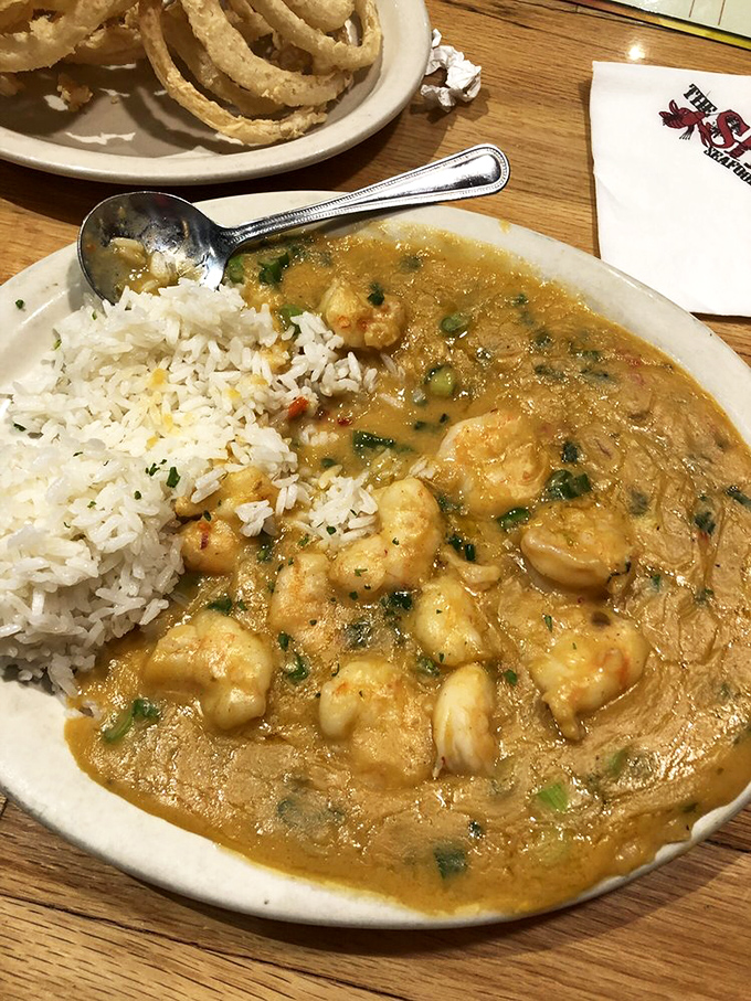 Plump shrimp swimming in a golden sea of spiced goodness alongside fluffy rice. Louisiana magic materialized in the heartland.
