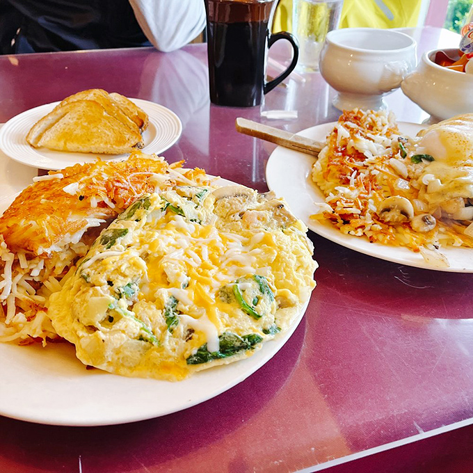 This open-faced breakfast sandwich, smothered in creamy sauce atop a throne of golden hash browns, is comfort food royalty. 