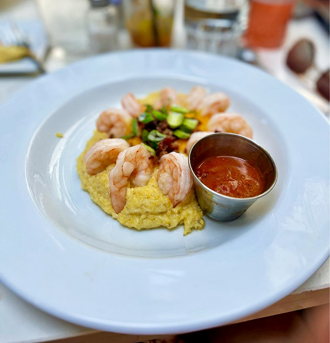 Shrimp and grits&mdash;the dish that launched a thousand Southern restaurants. 82 Queen's version showcases plump shrimp arranged like a crown atop creamy yellow corn goodness.