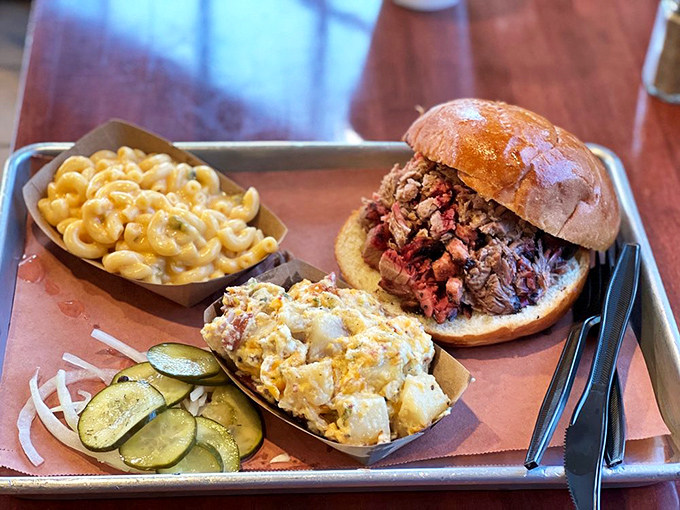 A barbecue plate that hits all the right notes: creamy mac and cheese, tangy slaw, and a sandwich that's practically begging you to unhinge your jaw.