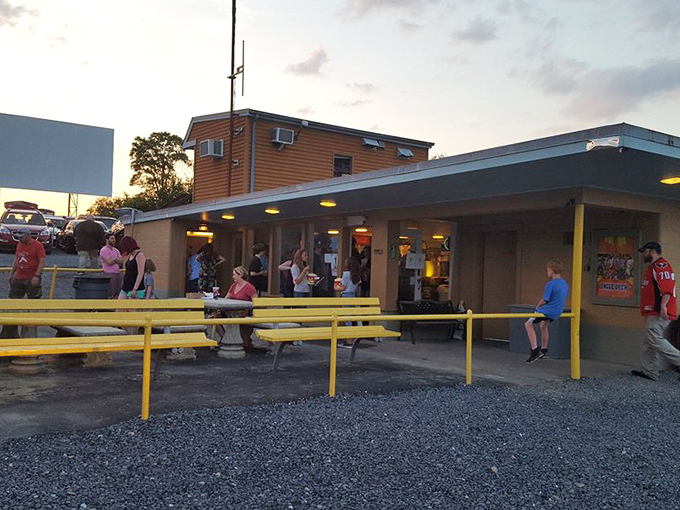 Concession stand conversations and snack selections&mdash;the intermission ritual that's as much a part of the experience as the feature presentation.