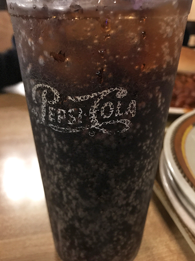 Even the Pepsi tastes better here, condensation racing down the glass like it's as excited about your barbecue as you are.