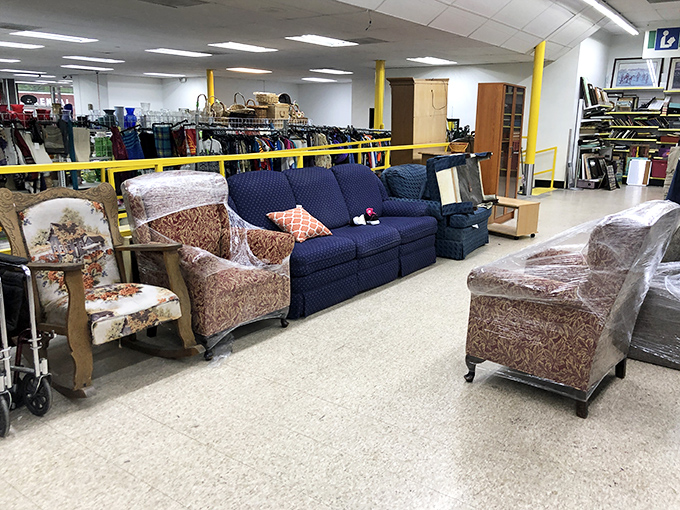 Sofa kingdom! These cushioned thrones await new living rooms to rule. That floral armchair has definitely seen some episodes of "Dallas" in its day.