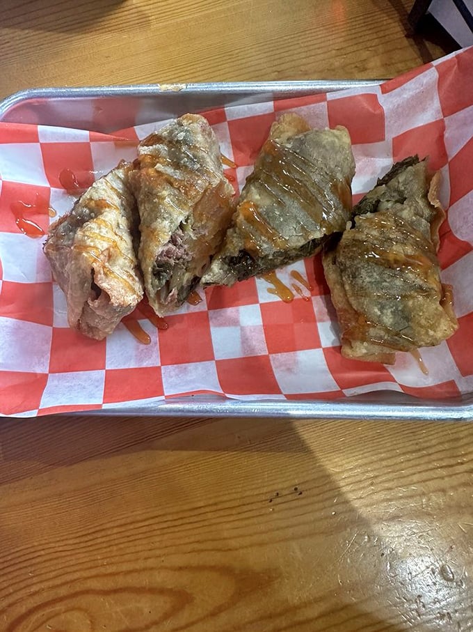 Soul rolls: like spring rolls took a delicious detour through the American South. That drizzle of sauce is the culinary equivalent of a chef's kiss.