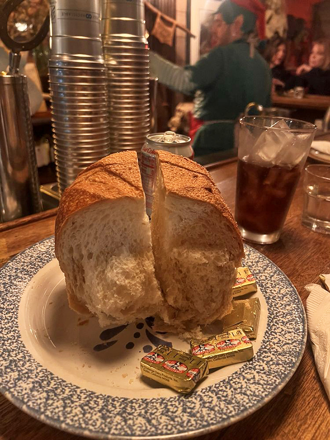 Sourdough bread so fresh it deserves its own zip code, with butter packets standing by like loyal soldiers ready for duty.