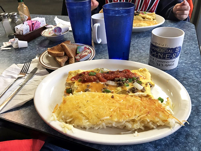 An omelet that's having an identity crisis in the best possible way—part breakfast, part fiesta, all delicious.