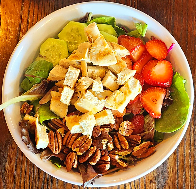 Who said salads can't be exciting? This vibrant bowl proves greens can party with the best of them when paired with strawberries and pecans.