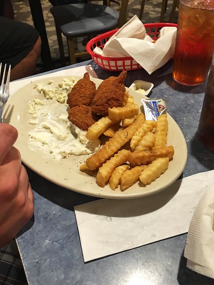 A plate so generous it needs its own ZIP code. The holy trinity of seafood, fries, and coleslaw&mdash;no wonder people drive for hours.