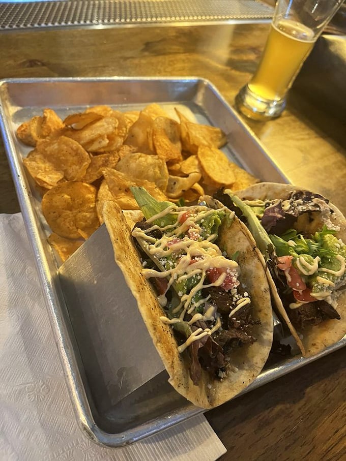 Tacos that bridge the gap between Southern and Mexican traditions, served with house-made chips that shatter with satisfying crispness.