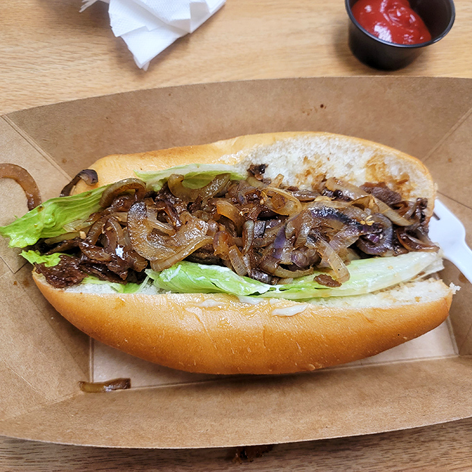 Thinly sliced ribeye meets caramelized onions in a sandwich that proves Squeeze Inn isn't just a one-trick pony&mdash;it's a full culinary rodeo.