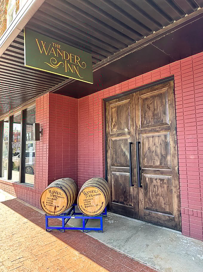 The Wander Inn's wooden doors and whiskey barrels promise the kind of evening where stories flow as freely as the spirits inside.