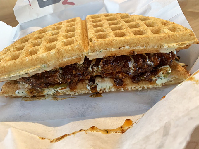 This sandwich doesn't just bring heat—it brings complexity. The sauce glistens with promises it fully intends to keep.