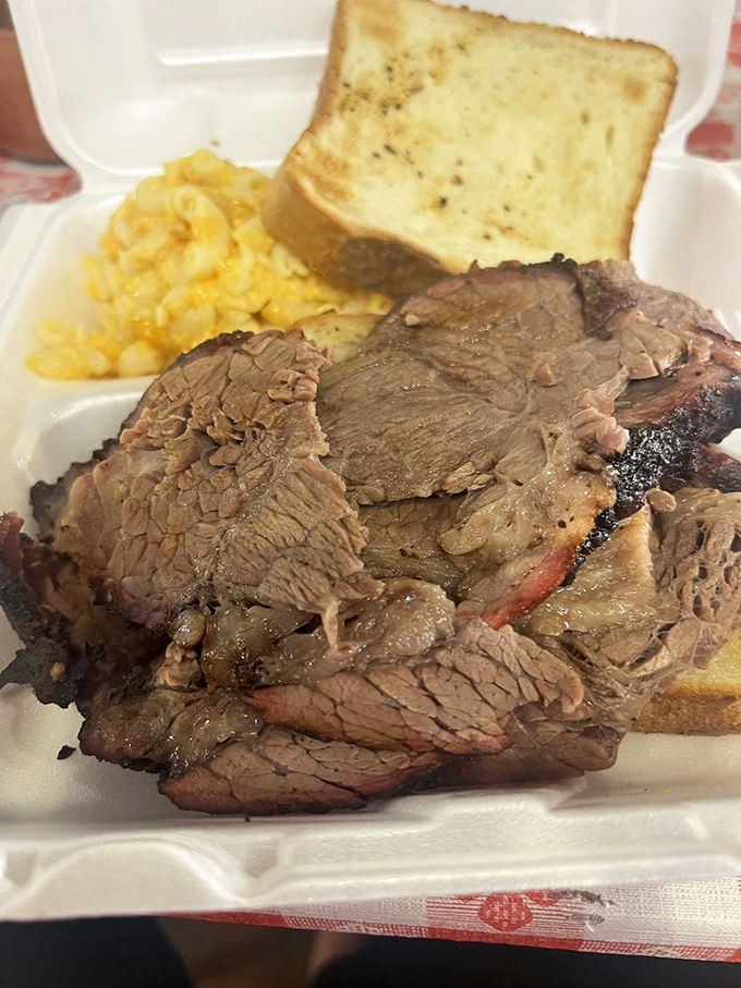 Texas toast: because sometimes the perfect vehicle for sopping up barbecue sauce needs to be as thick as a paperback novel. That brisket has bark that bites back.