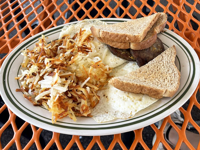 Breakfast done right&mdash;eggs, perfectly crisped hash browns, and toast waiting patiently for its butter bath. Morning glory on a plate.